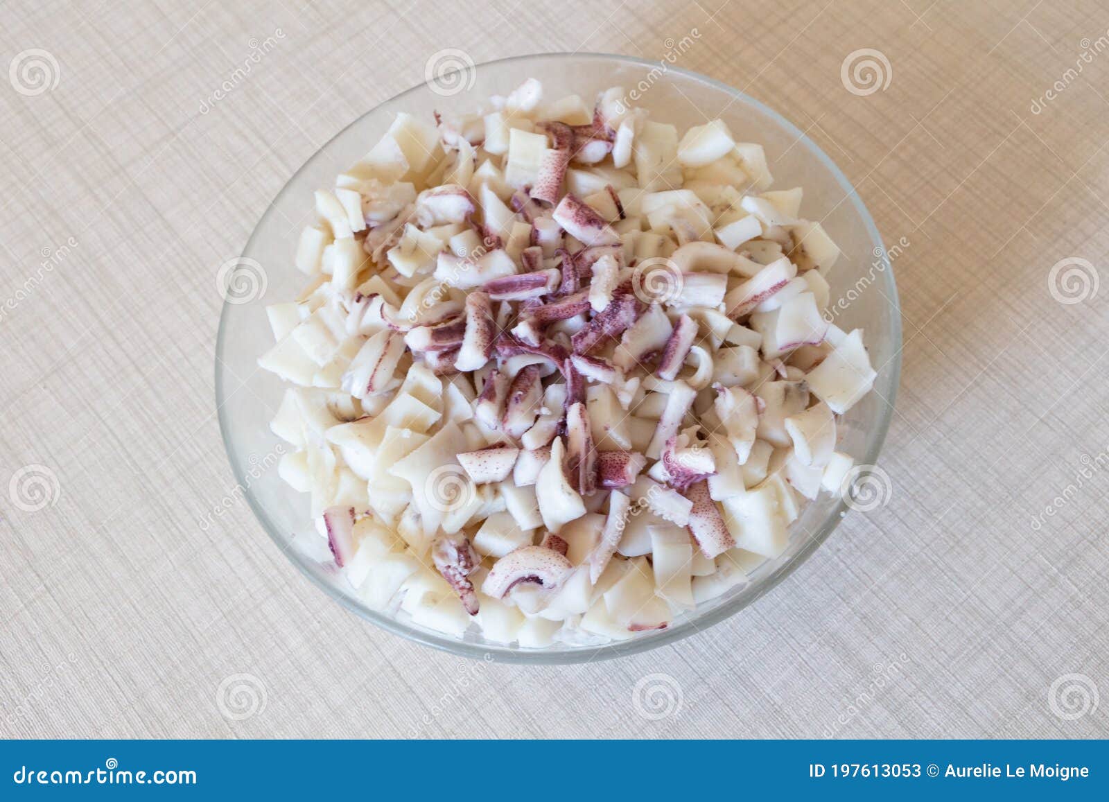 Pieces of squid in a bowl stock image. Image of white - 197613053
