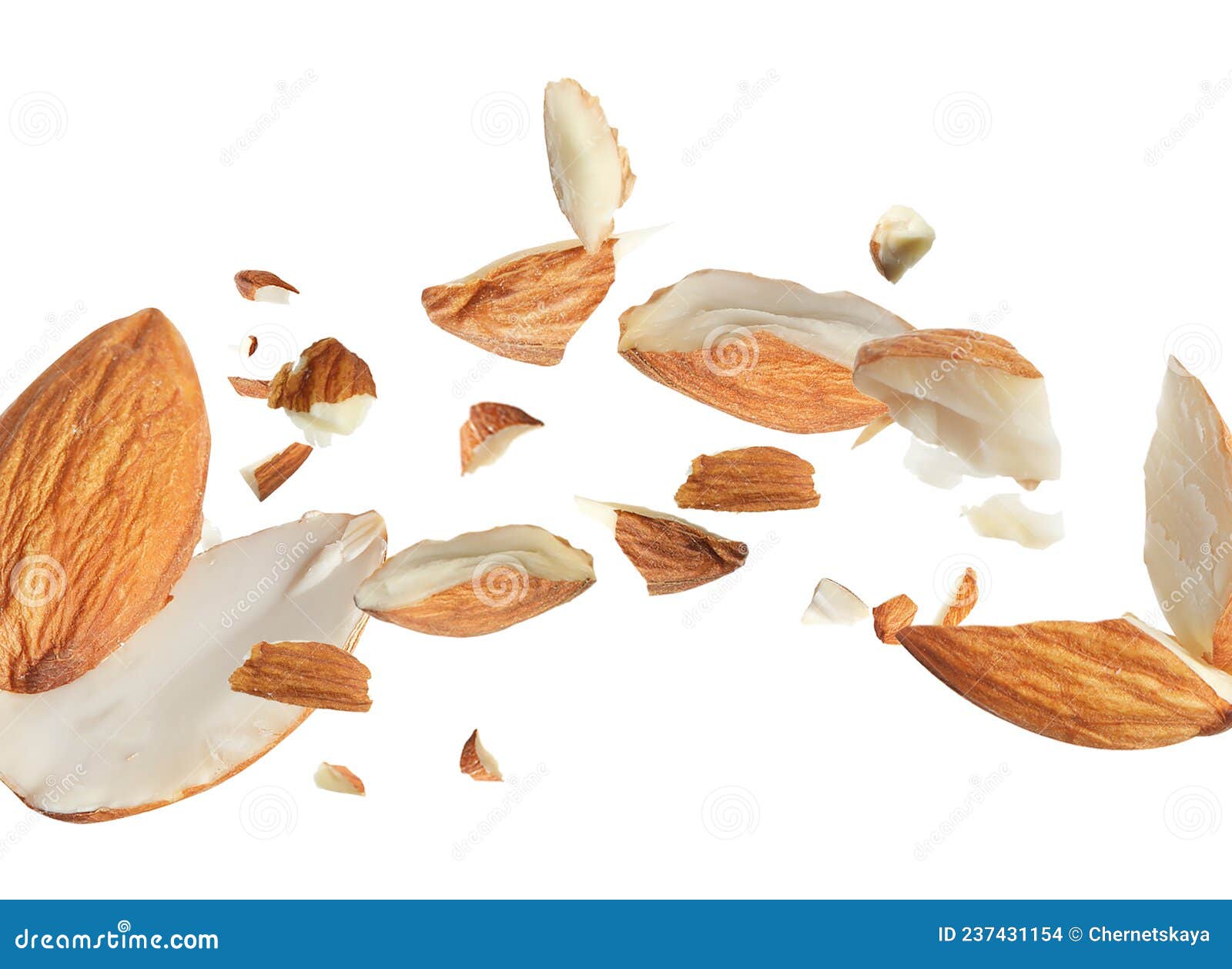 Pieces of Tasty Almonds Falling on White Background Stock Photo - Image ...