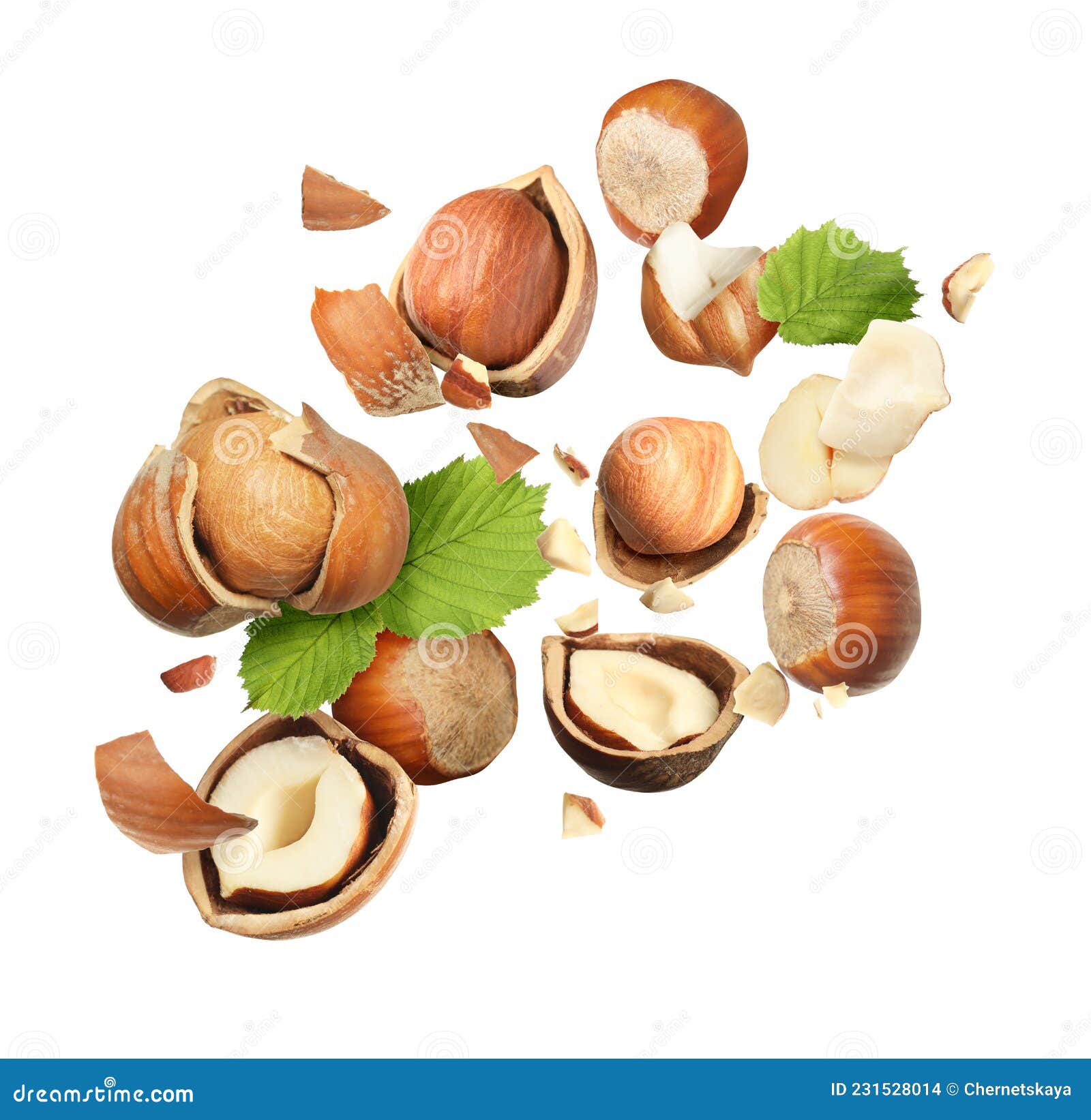 Pieces of Tasty Hazelnuts Falling on White Background Stock Photo ...