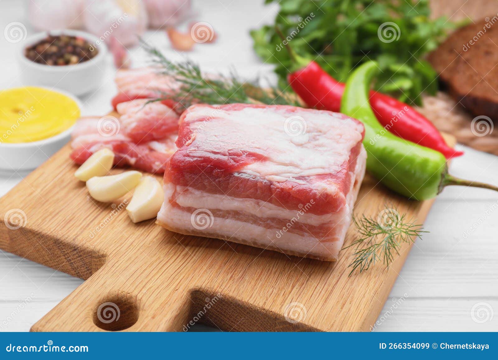 Pieces of Tasty Pork Fatback with Garlic and Chilli Pepper on White ...