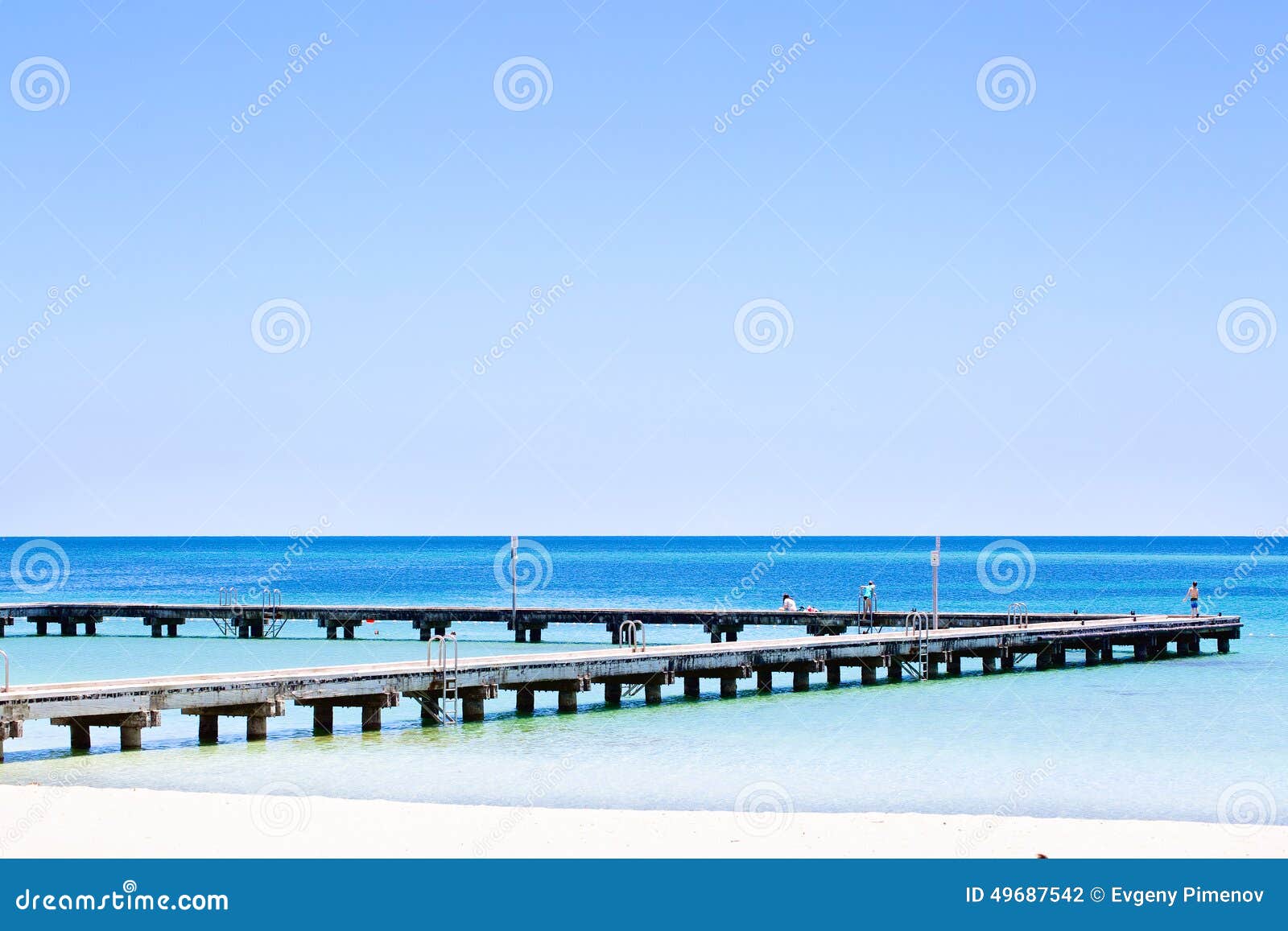 Pier in Blue Water of the Ocean Shore Stock Photo - Image of nature ...