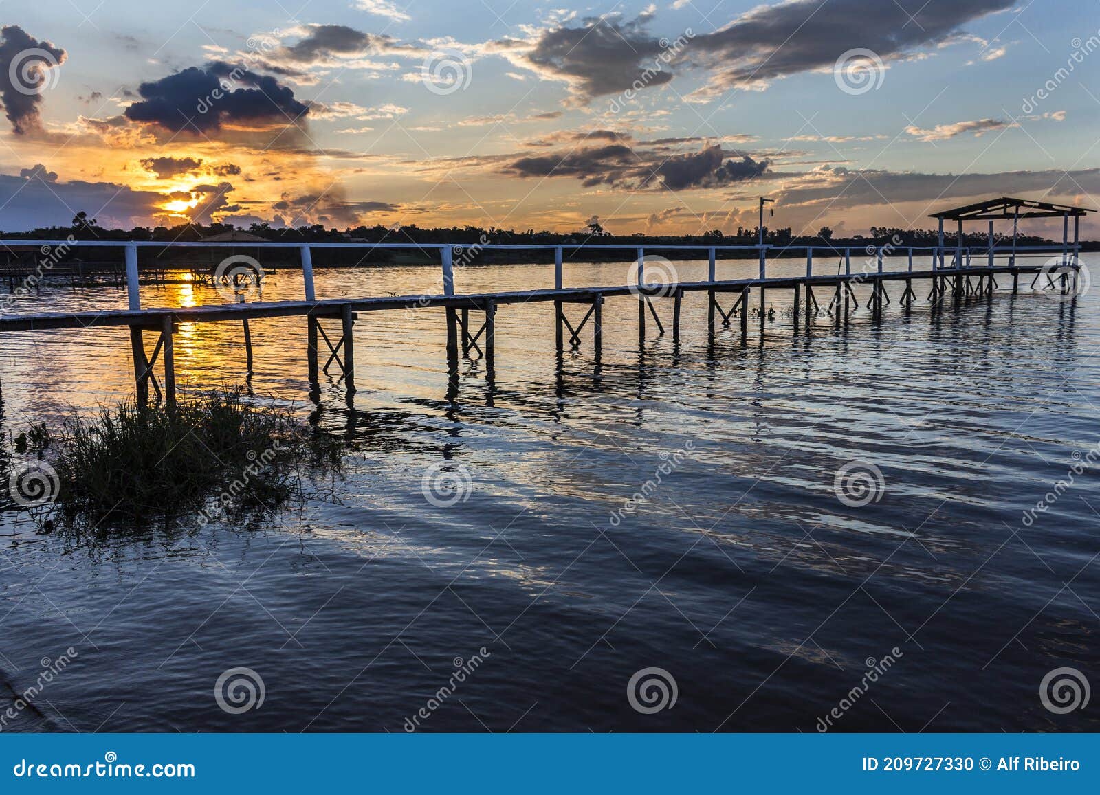Pier on the Edge of a Lake with Sunset Background Stock Photo - Image ...