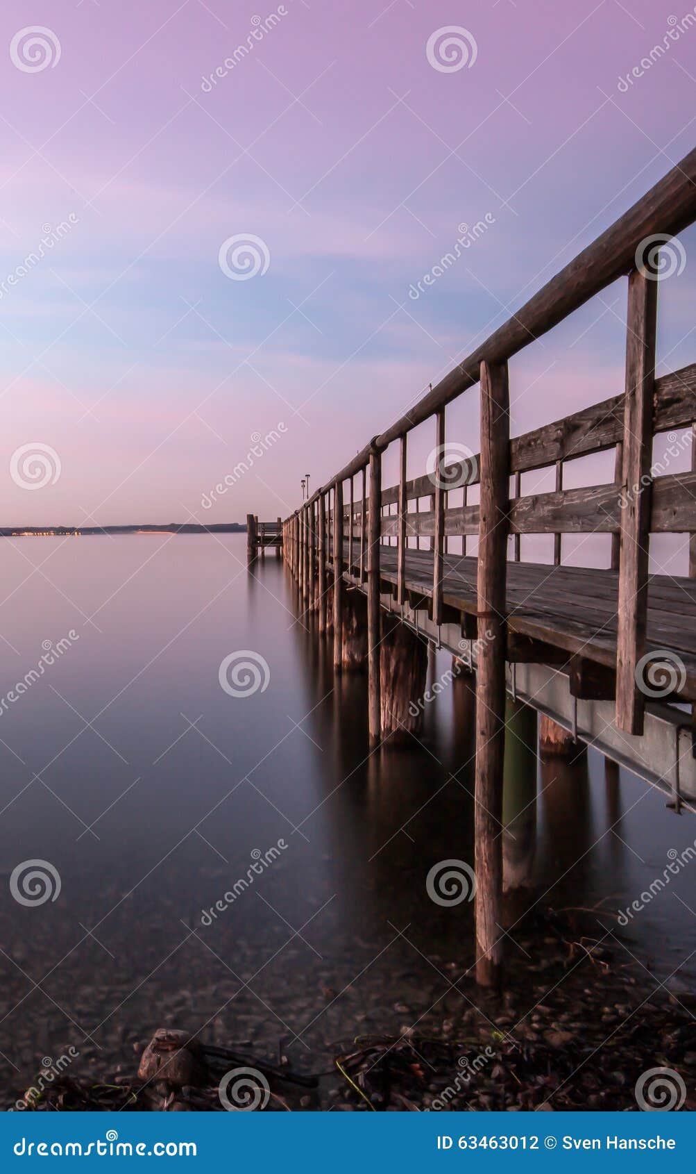 Pier on a lake at sunset stock photo. Image of landscapes - 63463012