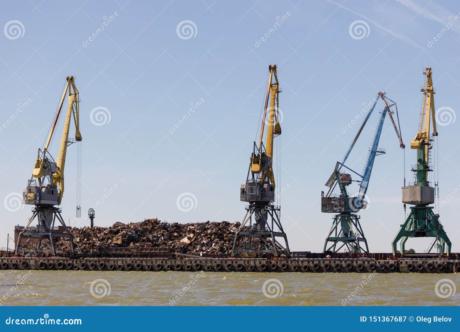 On The Pier Lies A Large Pile Of Metal Scrap Intended For Loading Into ...