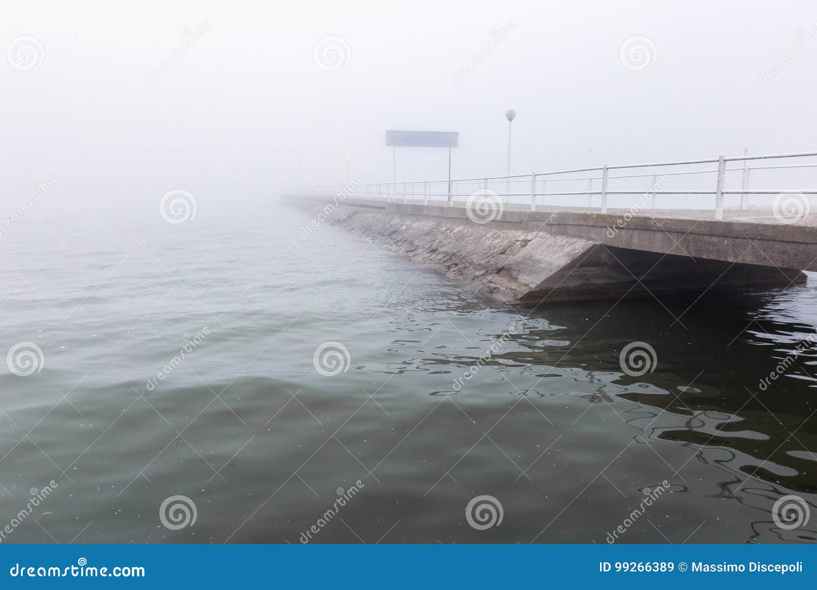 A pier in the midst of fog stock image. Image of calm - 99266389
