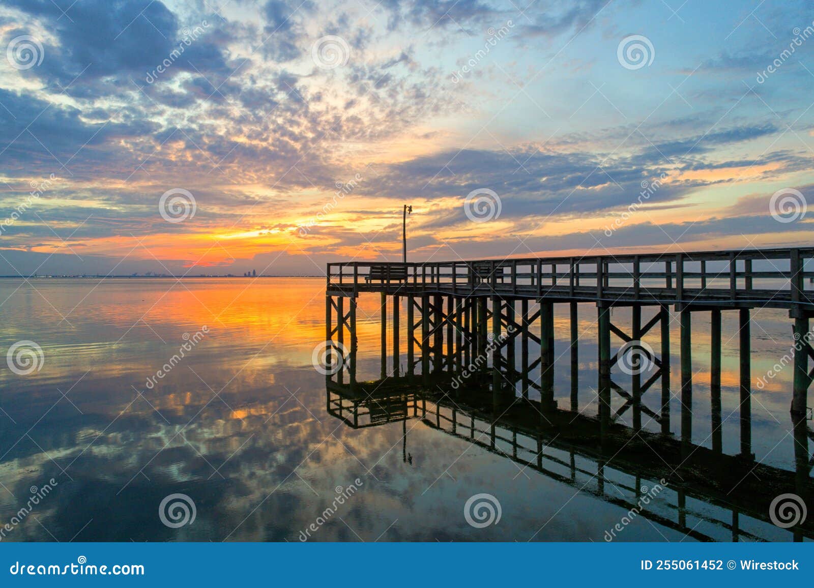 Pier on Mobile Bay at Sunset Stock Photo - Image of seascape, gulf ...