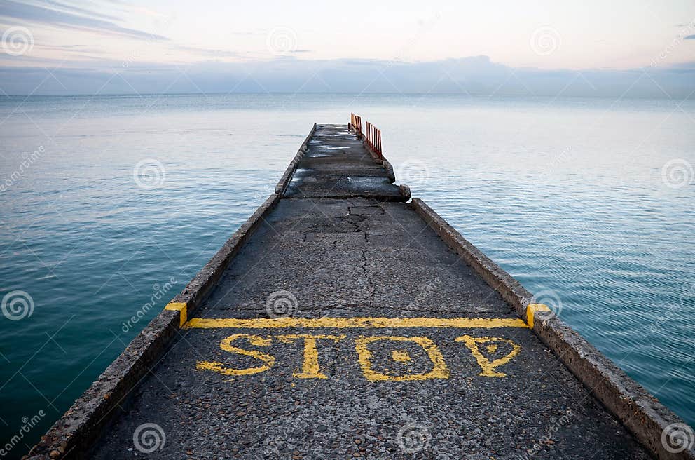 Pier Perspective with Yellow Stop Label Stock Photo - Image of outdoor ...