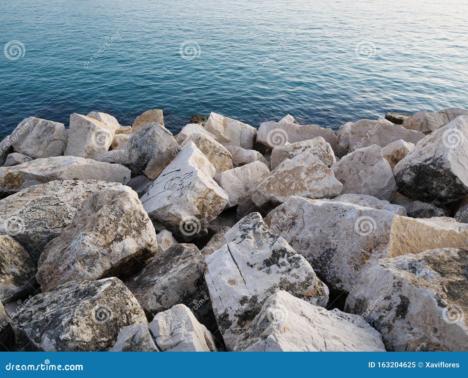 Pier Rocks in Front of the Sea Stock Image - Image of scenery, wave ...