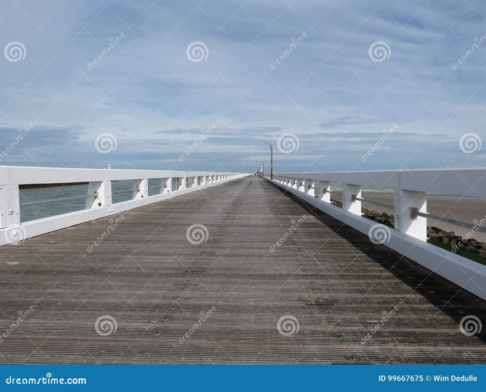 Pier stock image. Image of sand, jetty, sailboat, cloud - 99667675