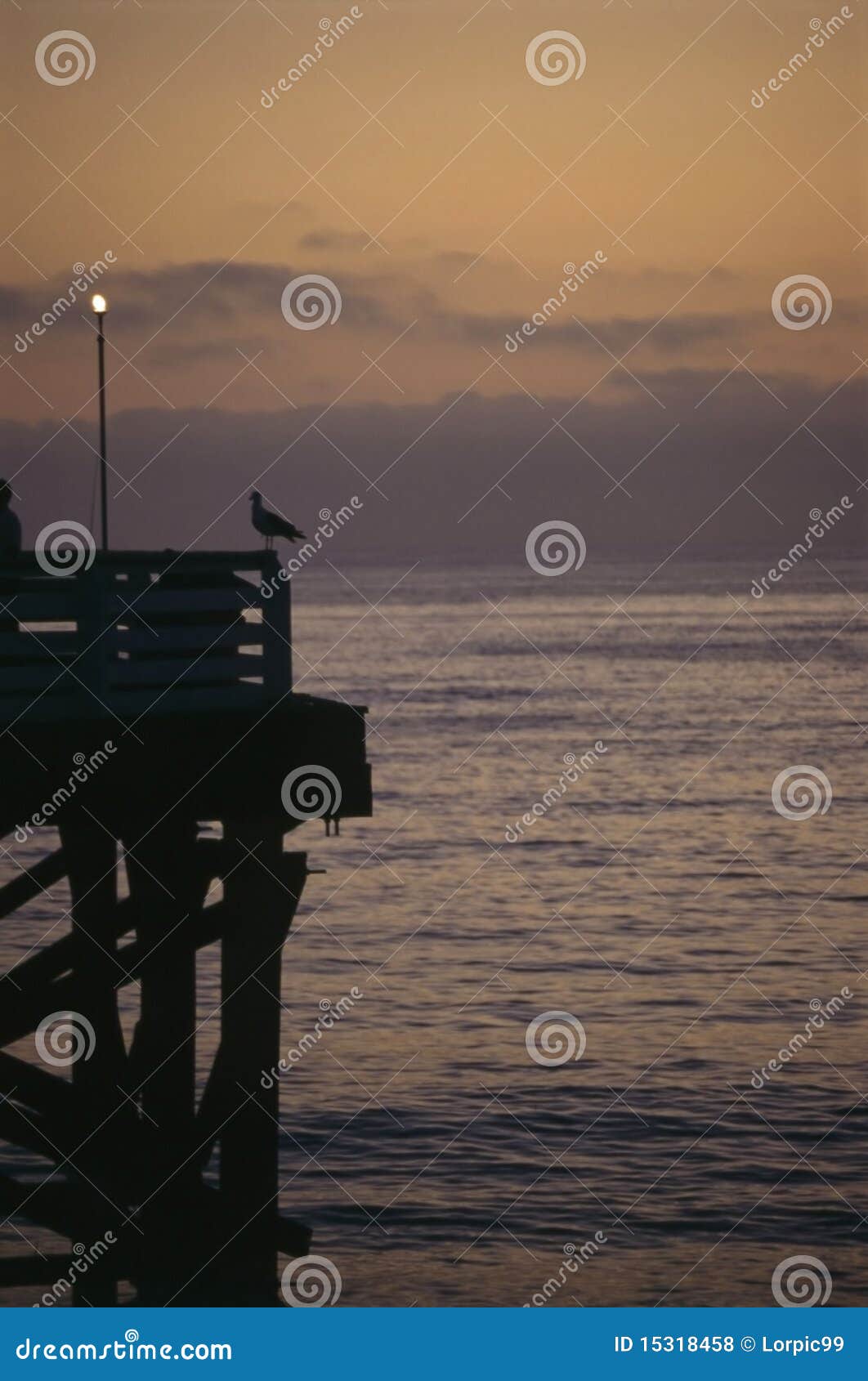 Pier at sunset stock photo. Image of ocean, sunset, people - 15318458
