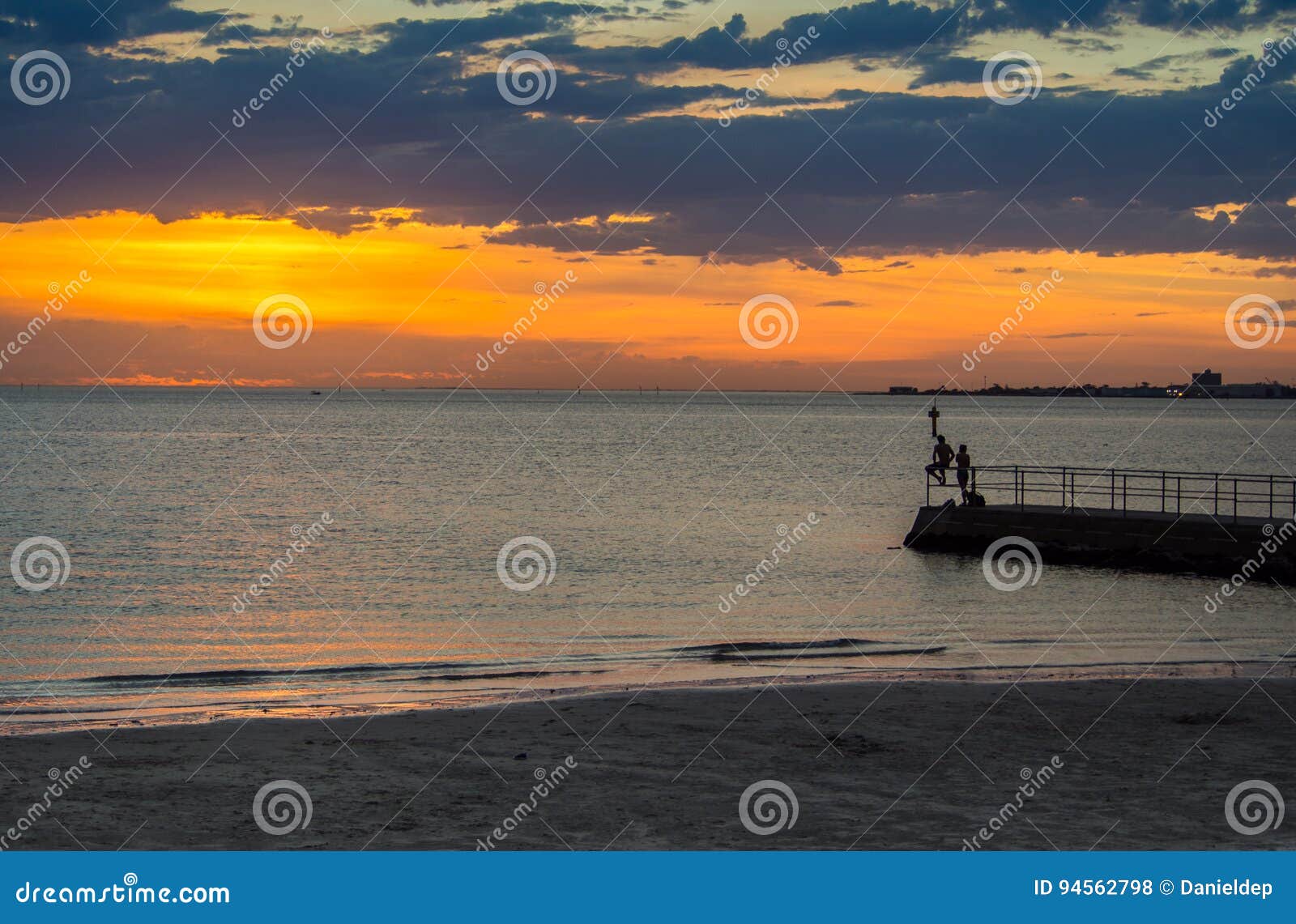 Pier at Sunset stock photo. Image of cloud, coast, landscape - 94562798