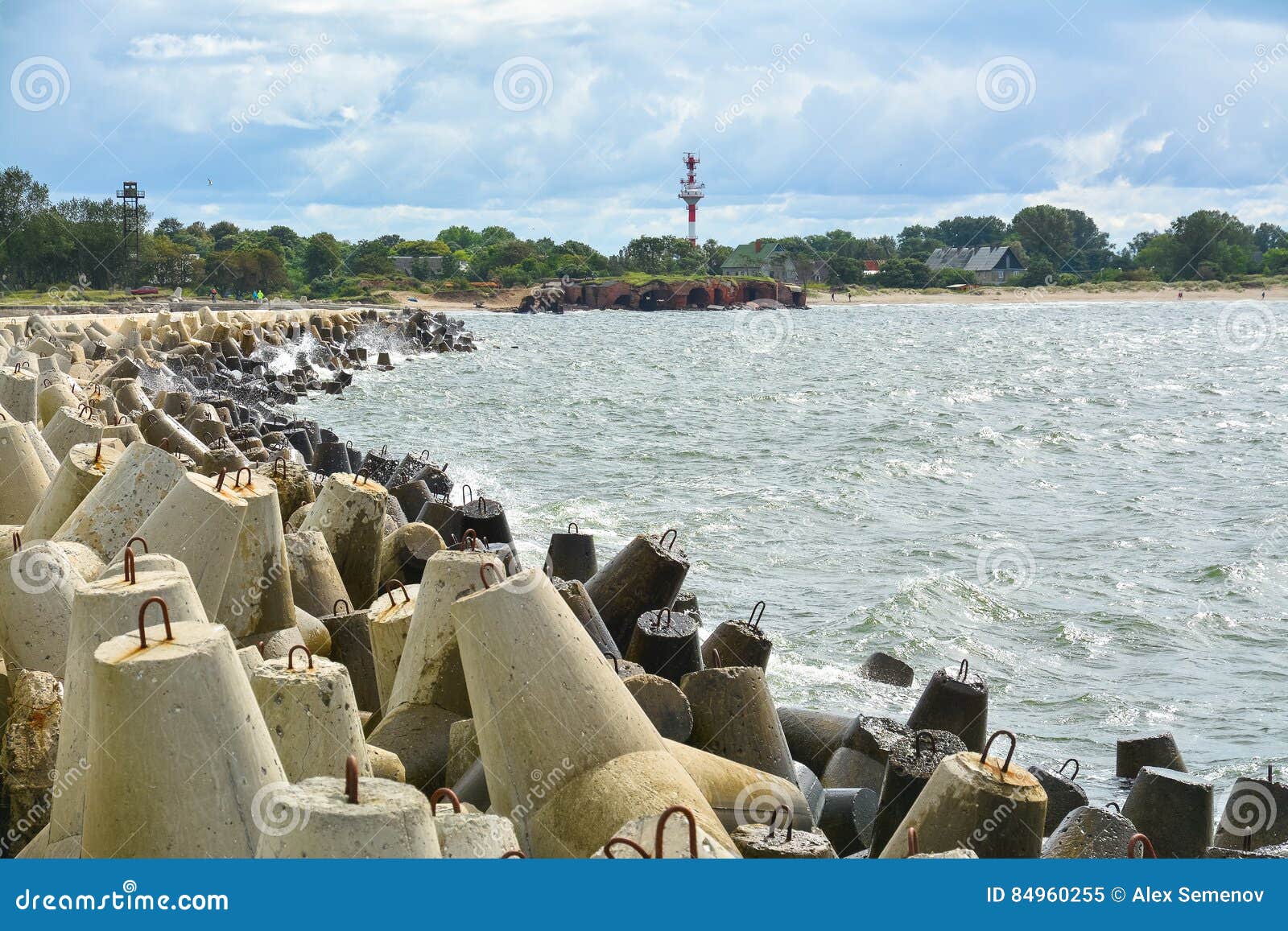 Pier with Wave Breakers, a Lighthouse and an Old Fort Stock Image ...