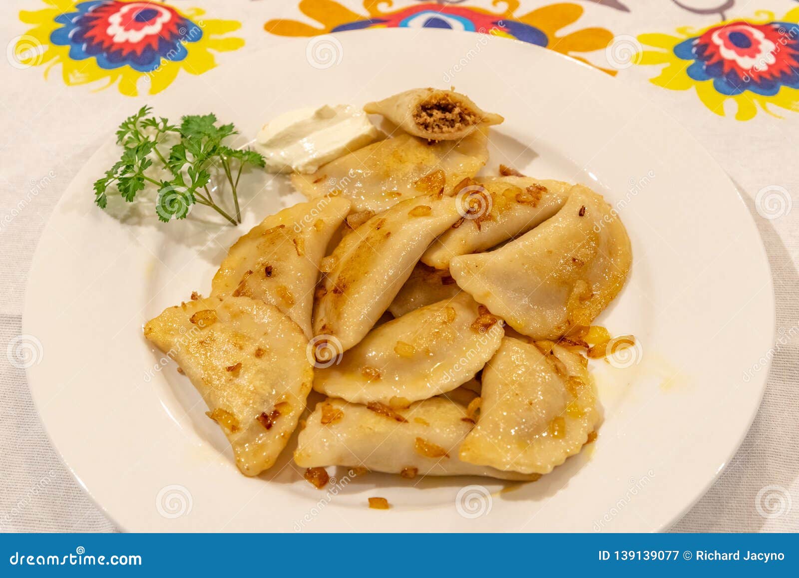 Pierogi served on a plate stock image. Image of pierogi - 139139077
