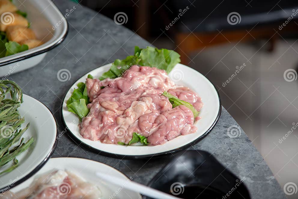 Pig brains on plate, pork stock photo. Image of delicacy - 254820332