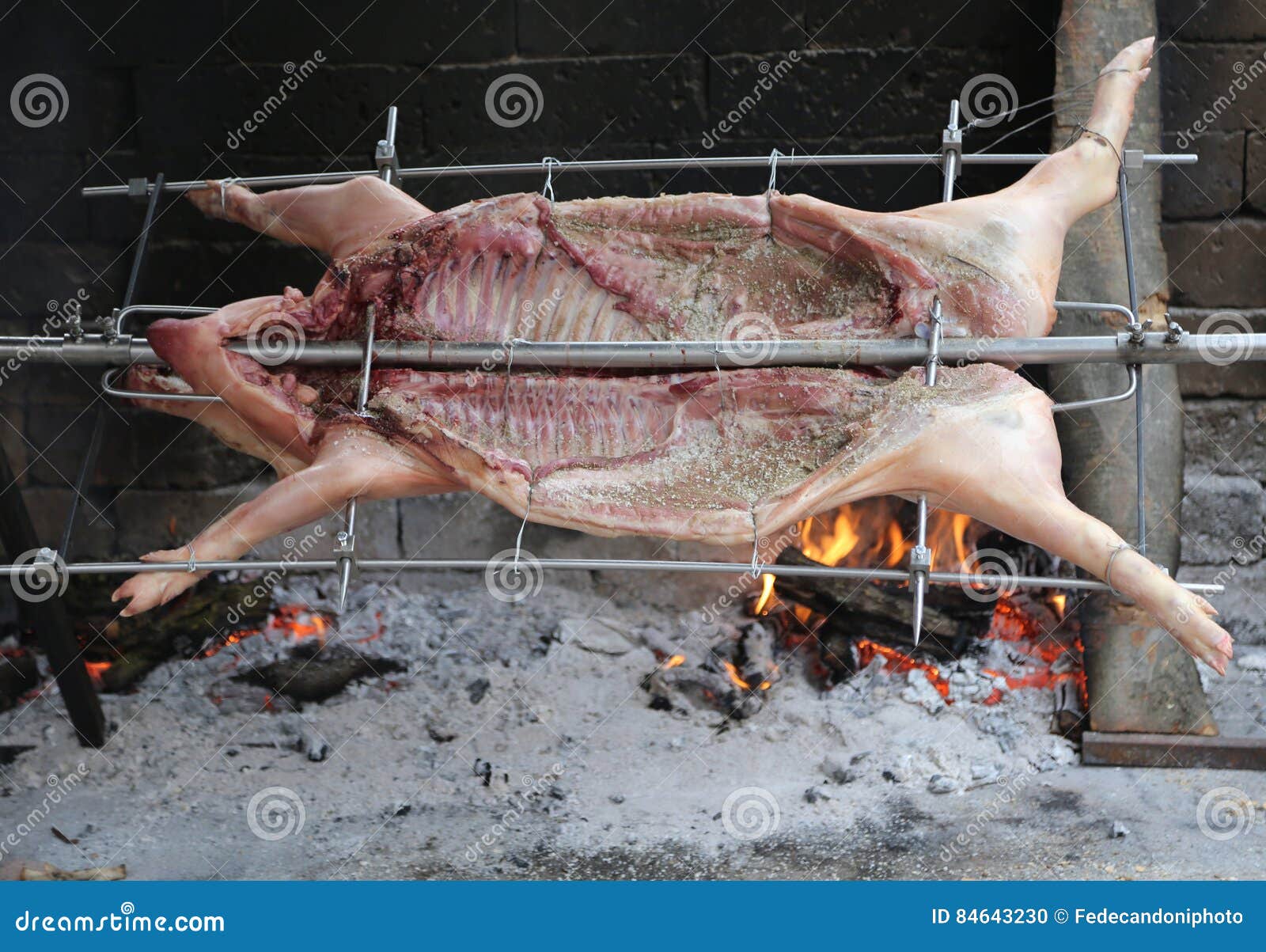 Pig on the Spit and Slowly Cooked on the Large Fireplace during Stock ...