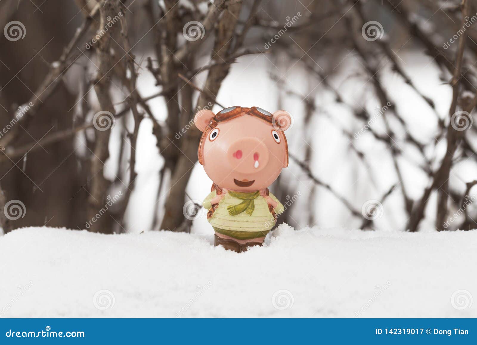 Piggy dolls in the snow stock image. Image of winter - 142319017