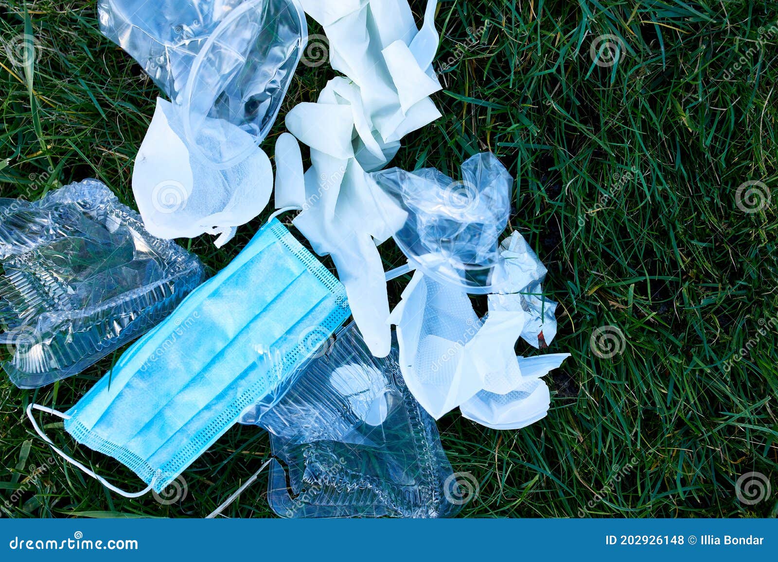 Piile of Scattered Garbage on a Background of Green Grass Stock Photo ...