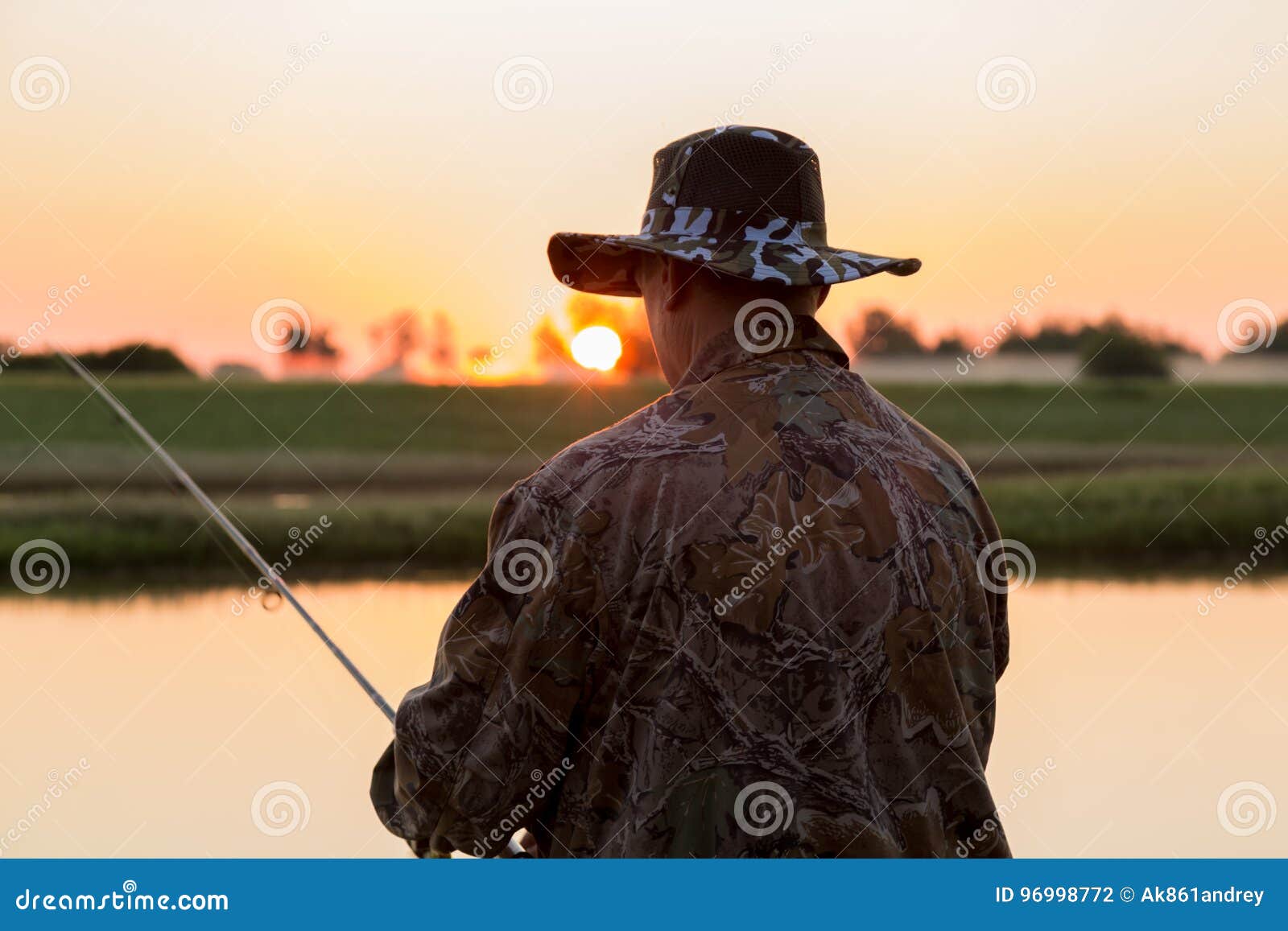 Pike hunter on the river stock photo. Image of light - 96998772