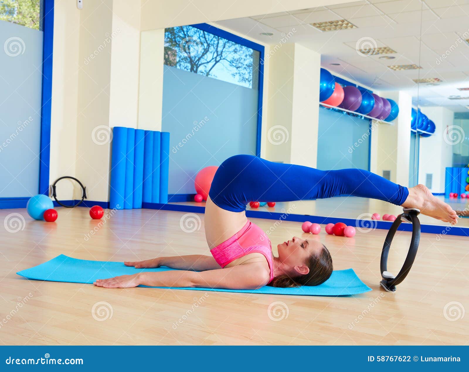 Pilates Woman Roll Over Magic Ring Exercise Stock Photo - Image of ...