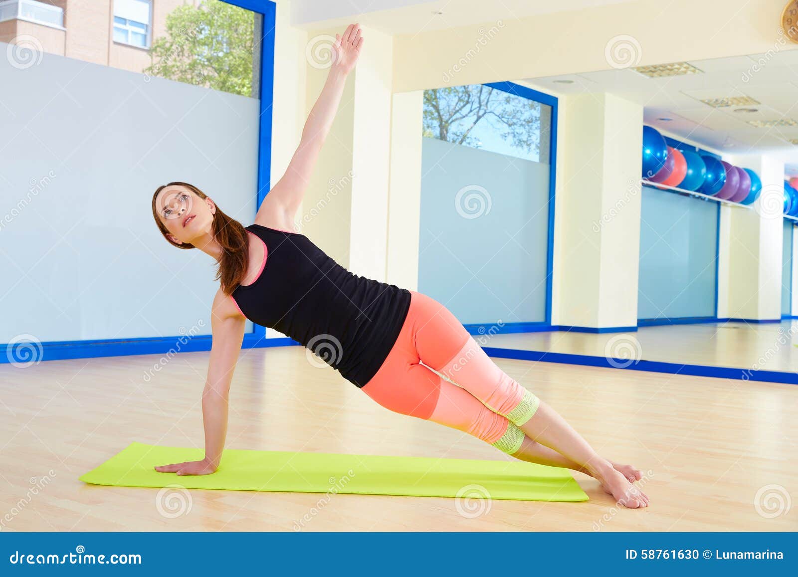 Pilates Woman Side Bend Exercise Workout at Gym Stock Photo - Image of ...