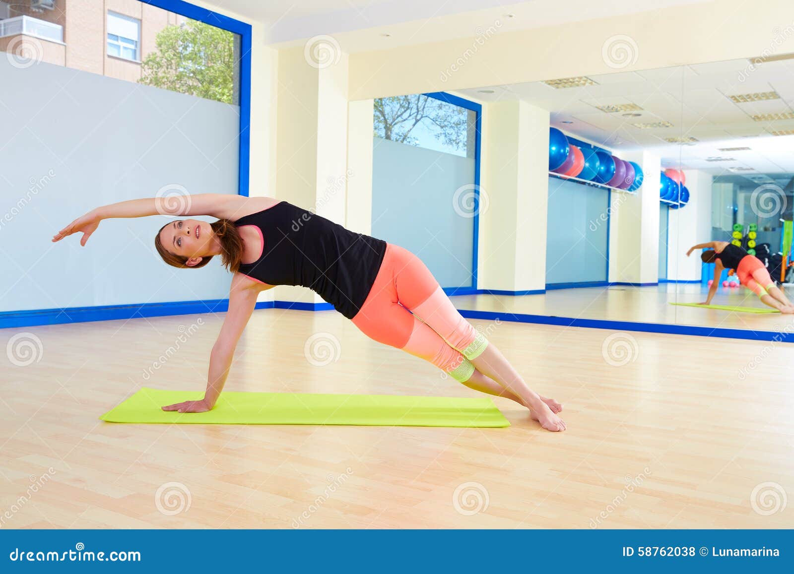 Pilates Woman Side Bend Exercise Workout at Gym Stock Photo - Image of ...