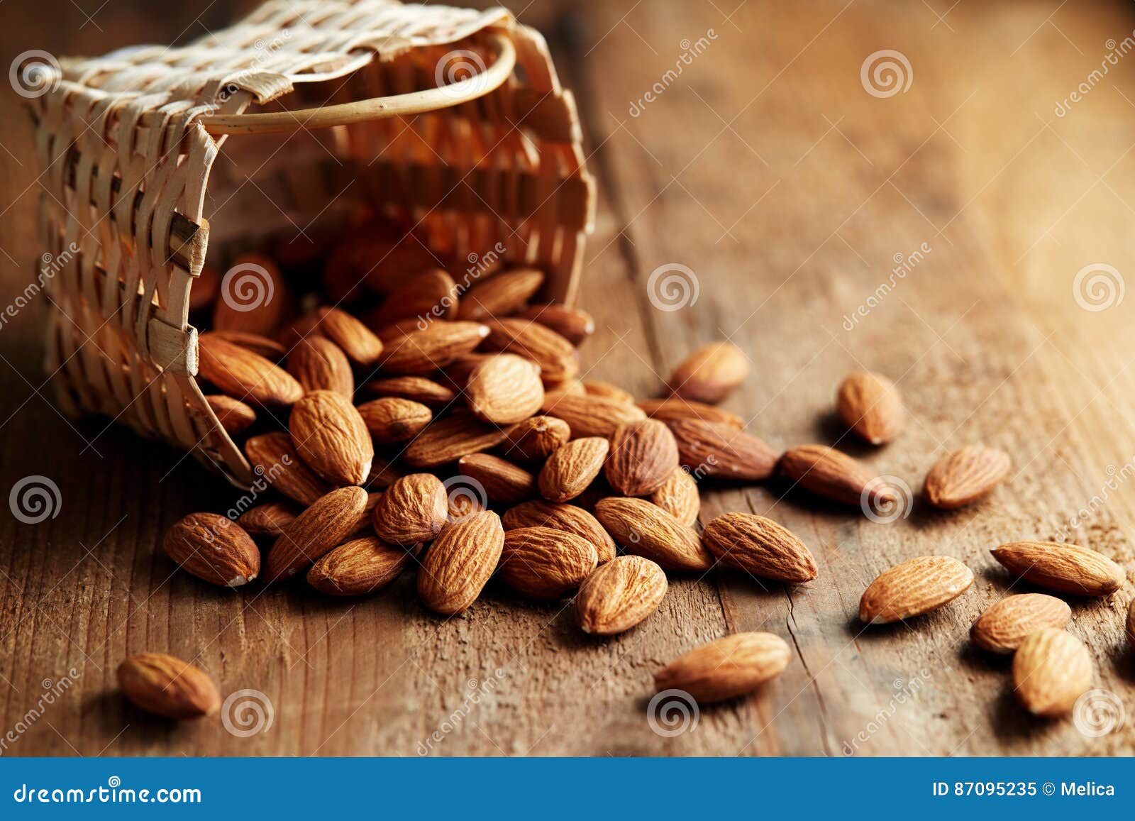 A Pile of Almonds on a Wooden Surface Stock Image - Image of container ...