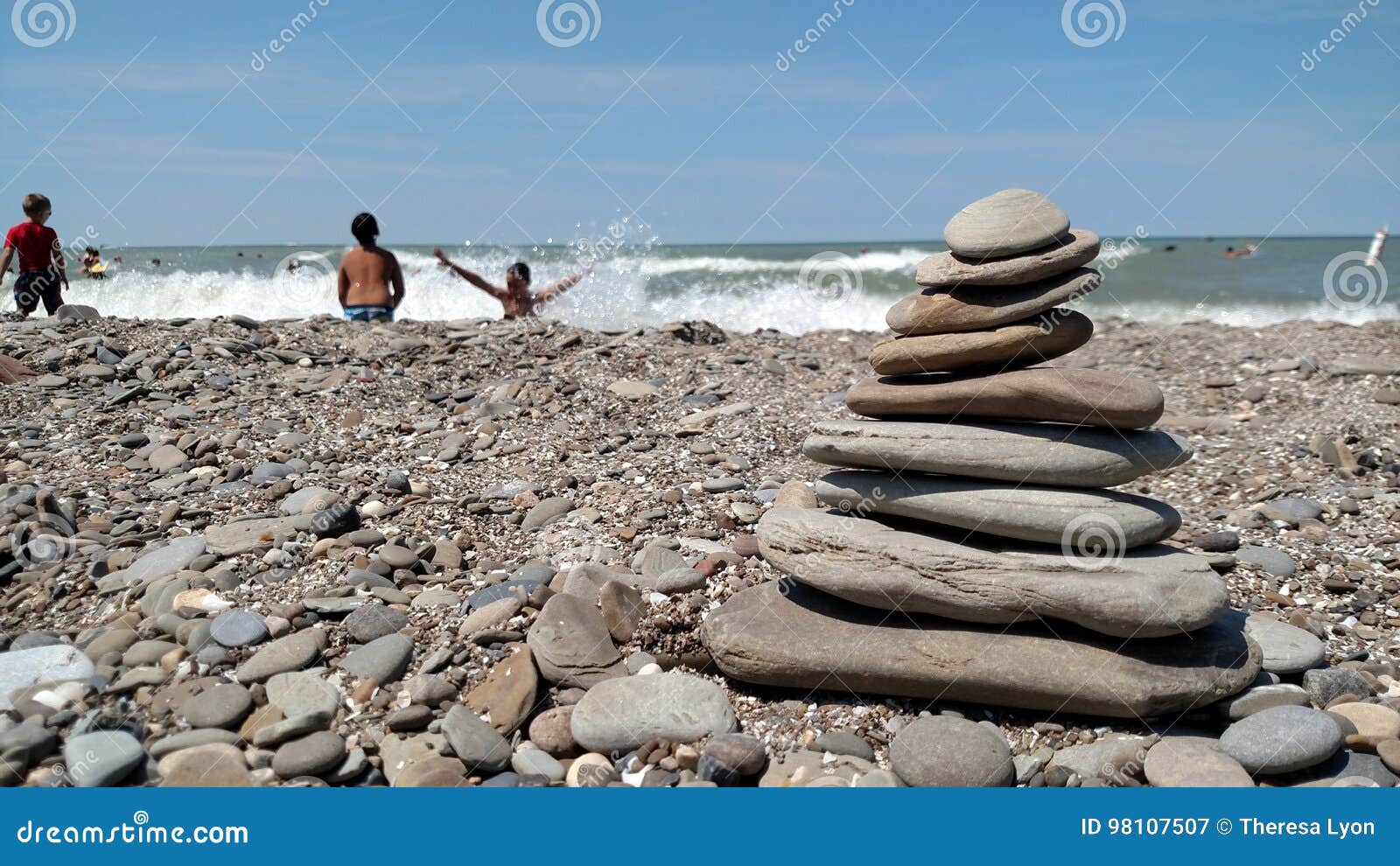Pile of Balanced Rocks on the Rocky Shore of a Beach Editorial ...
