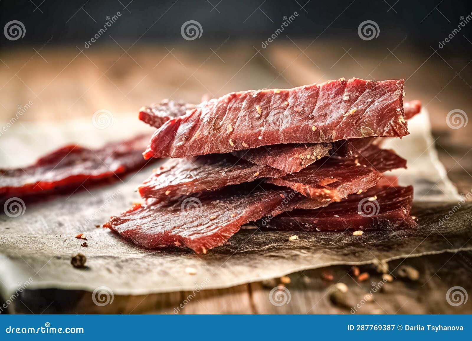 Pile of Beef Dried Peppered Jerky on Rustic Wooden Table. Stock ...