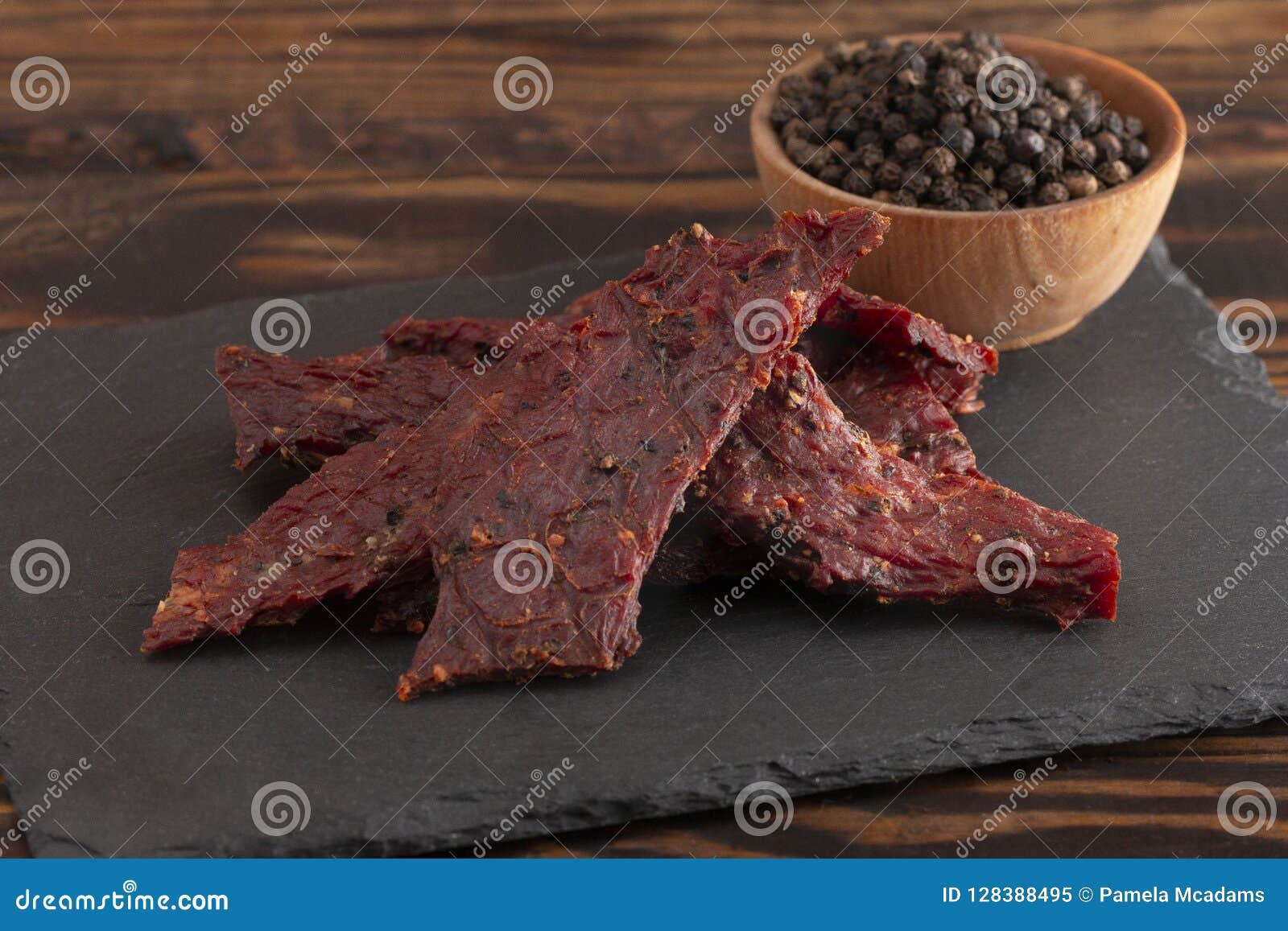 Pile of Black Pepper Beef Jerky on a Rustic Wooden Table Stock Image ...