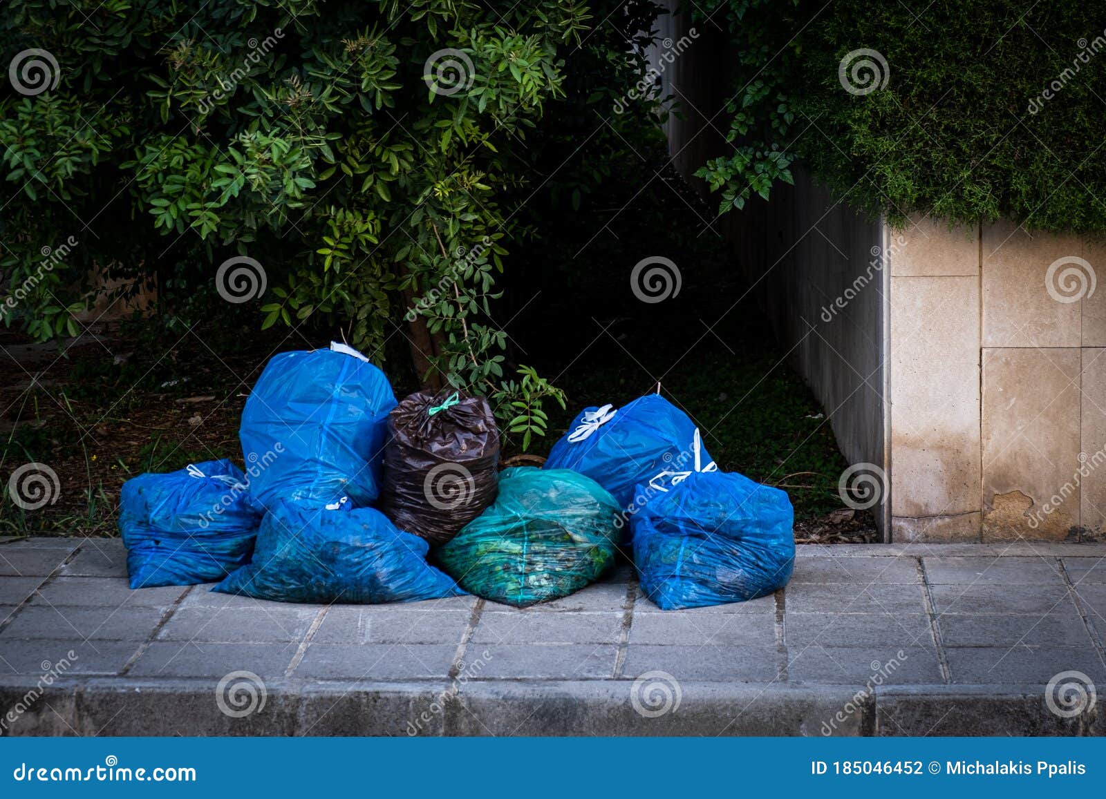 Pile of Blue and Black Garbage on the Footpath at Side Road Stock Photo ...