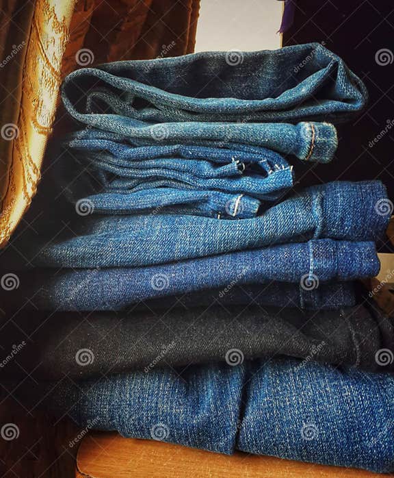 A pile of blue denim jeans stock image. Image of denim - 198406271