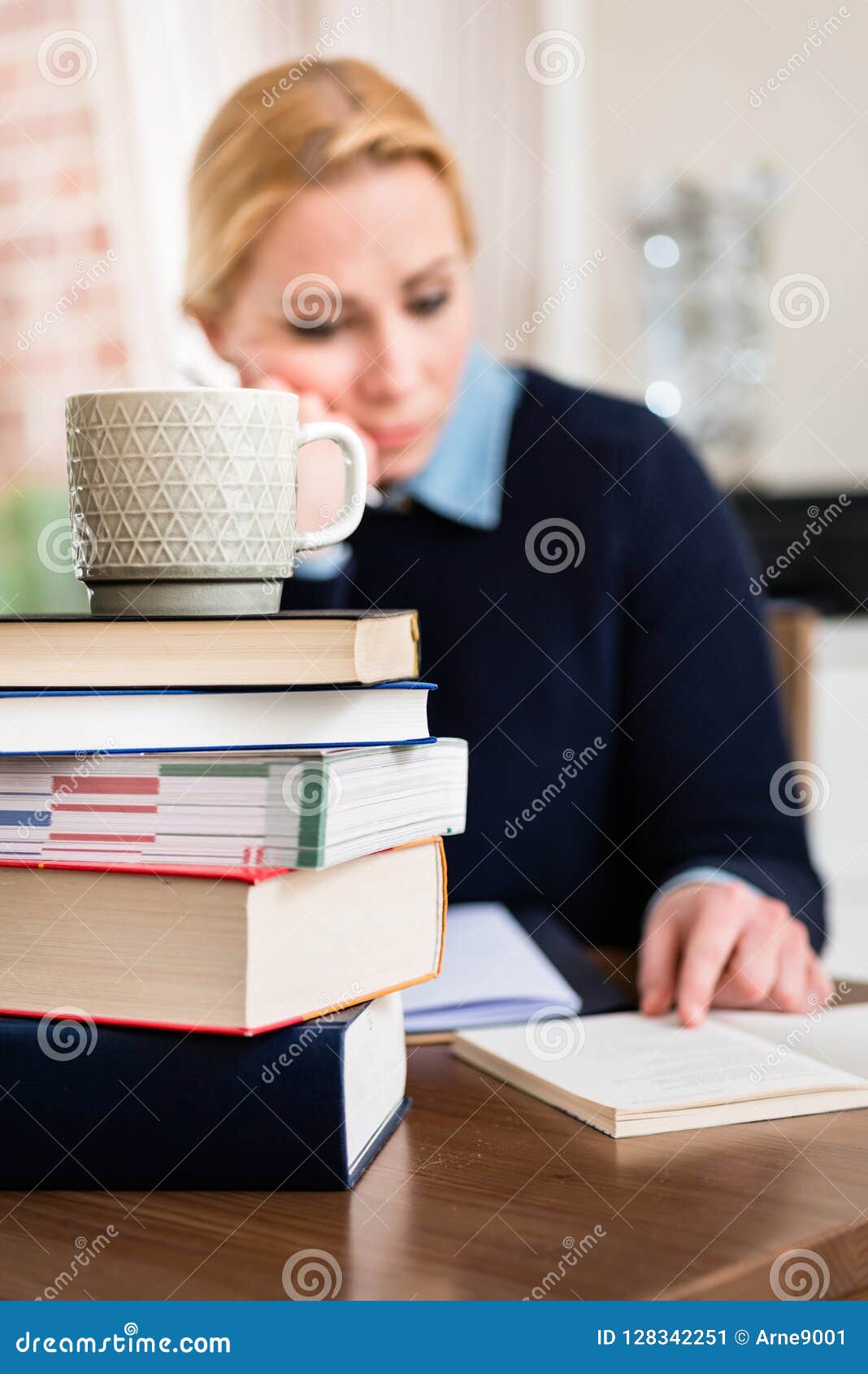 Pile of Books in Front of Woman Reading Book Stock Image - Image of ...