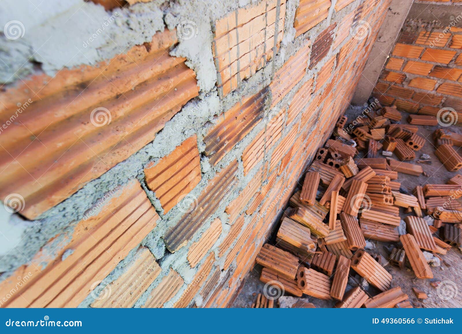 Pile of Bricks in Construction Site with Brick Wall Stock Photo - Image ...