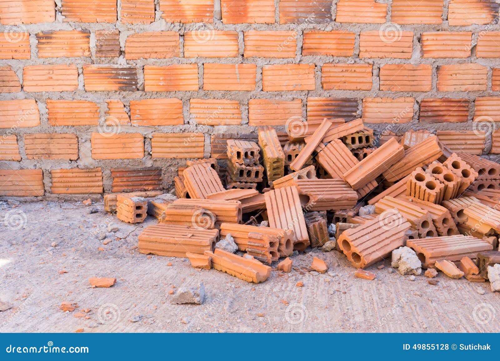 Pile of Bricks in Construction Site with Brick Wall Stock Photo - Image ...