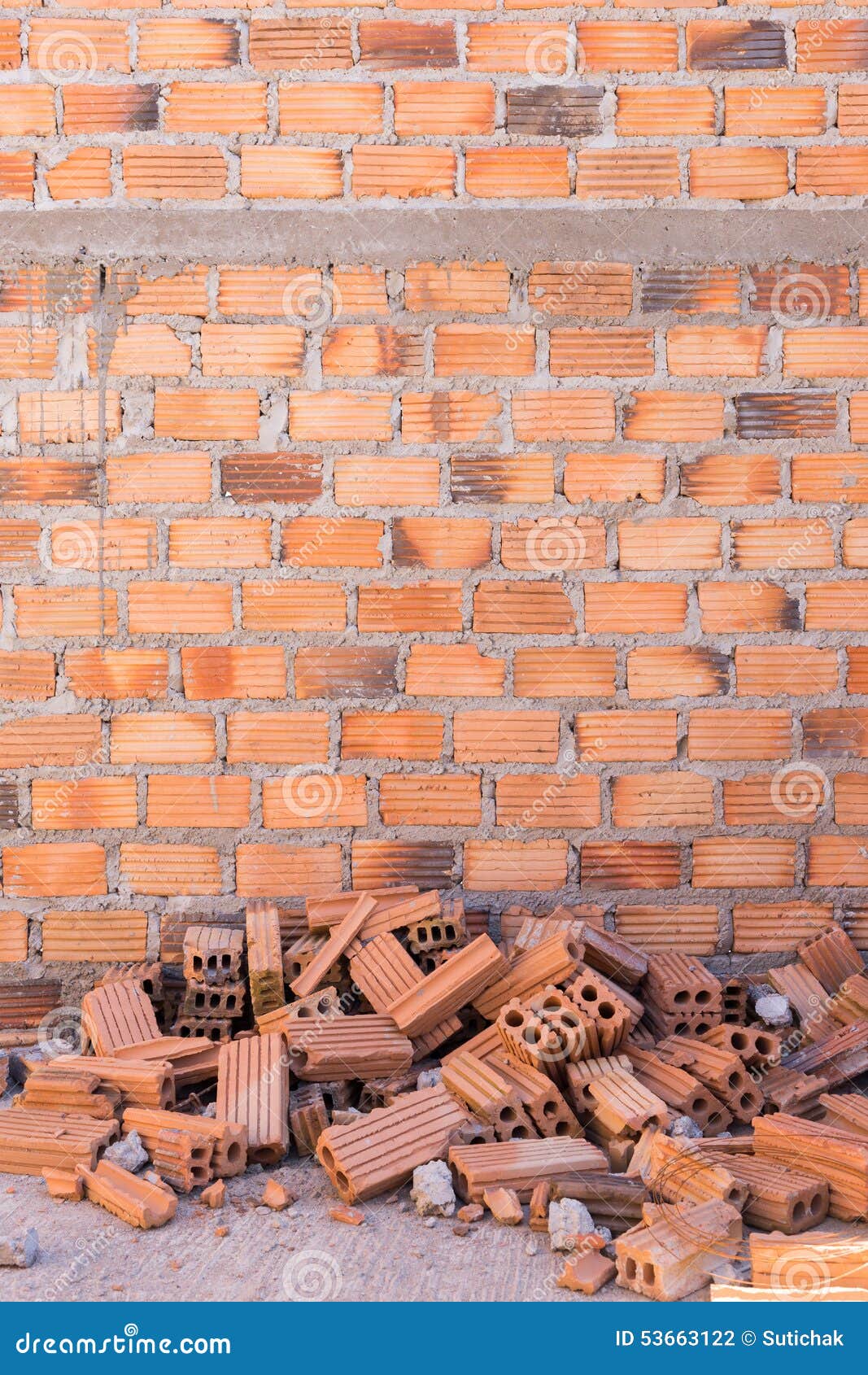 Pile of Bricks in Construction Site with Brick Wall Stock Photo - Image ...