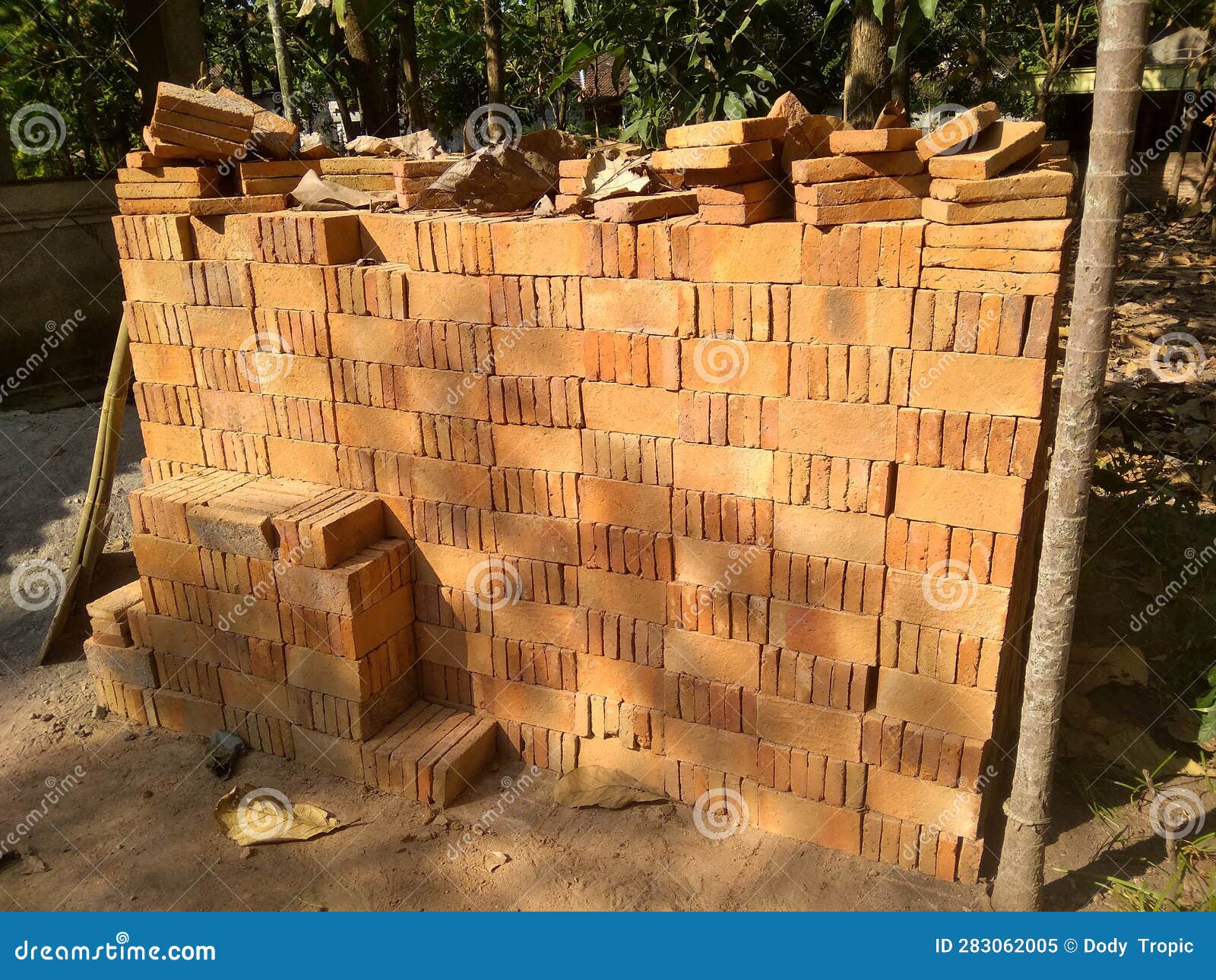 Pile of Bricks Arranged Neatly on Ground at Yard Stock Image - Image of ...