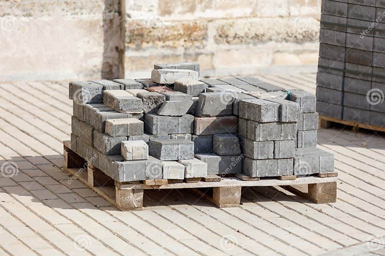 A Pile of Bricks on a Pallet Stock Photo - Image of stack, concrete ...