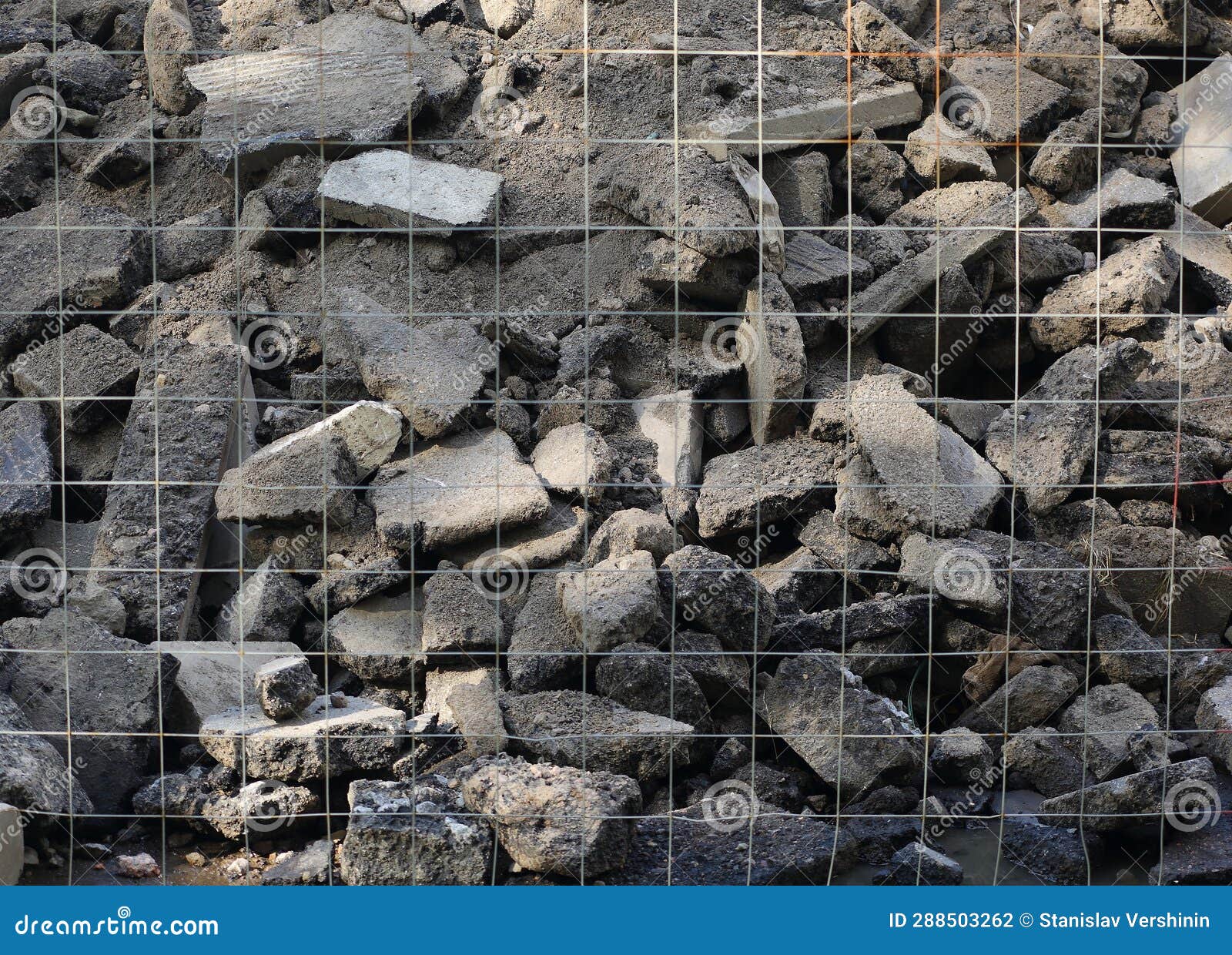 Pile of Broken Asphalt Behind a Lattice Fence Stock Photo - Image of ...