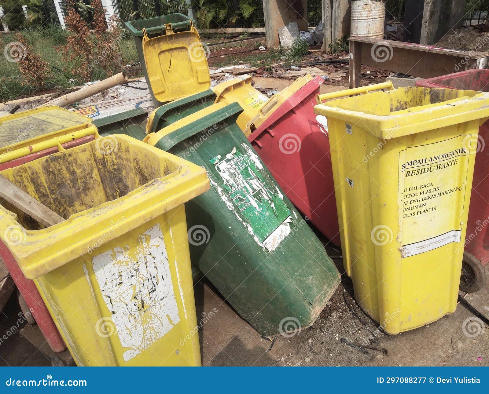 A Pile of Broken Trash Cans Lay in the Backyard of a Gym Stock Image ...