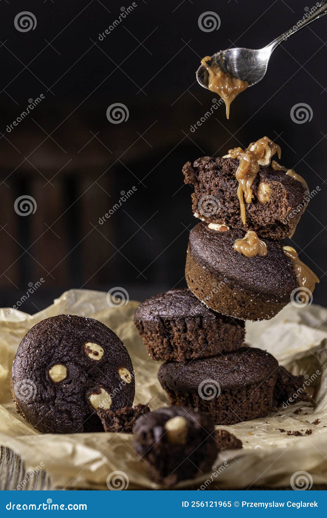 A Pile of Brownie Muffins with Liquid Caramel Falling from a Spoon ...