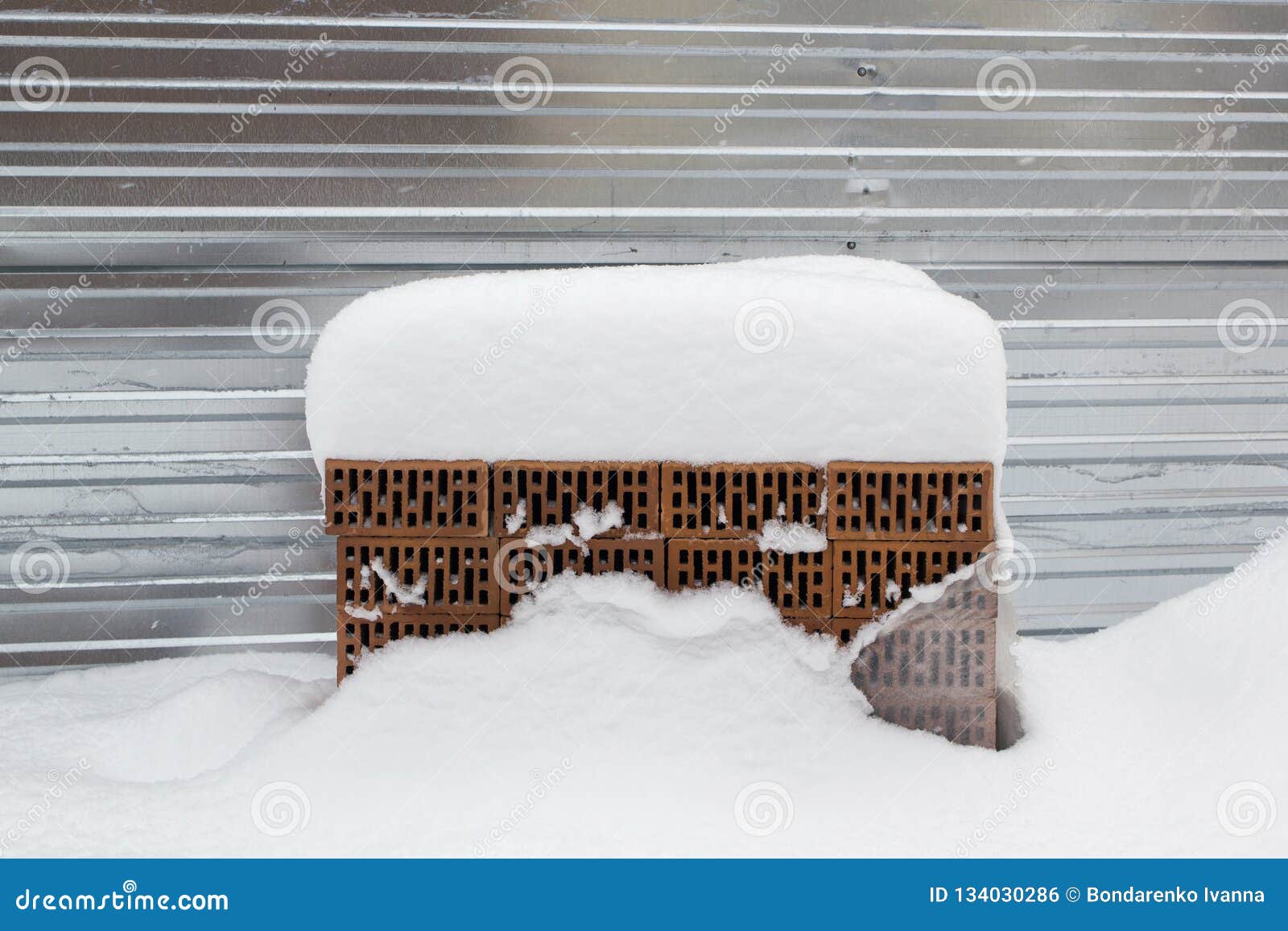 Pile of Building Bricks in the Winter Under the Snow Stock Photo ...