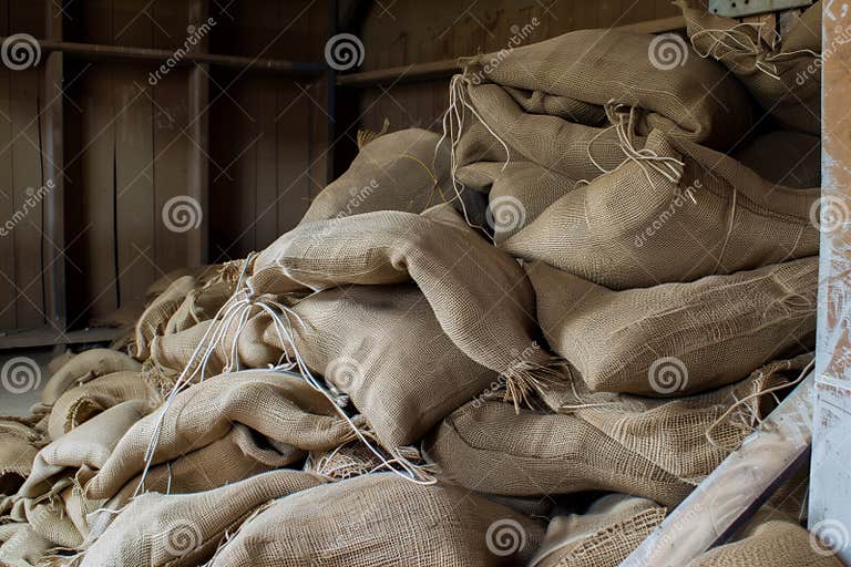 Pile of Burlap Sacks in a Storage Room Stock Image - Image of hessian ...
