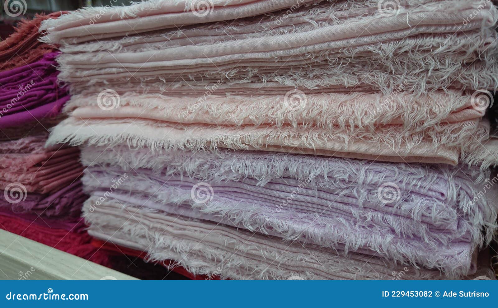 A Pile of Cloths on a Clothes Store in the Market Stock Photo - Image ...