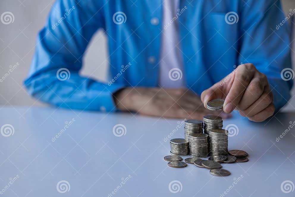 Pile of Coins on Table with Calculator Saving Money and Coin Investment ... Pile of Coins on Table with Calculator Saving Money and Coin Investment ...