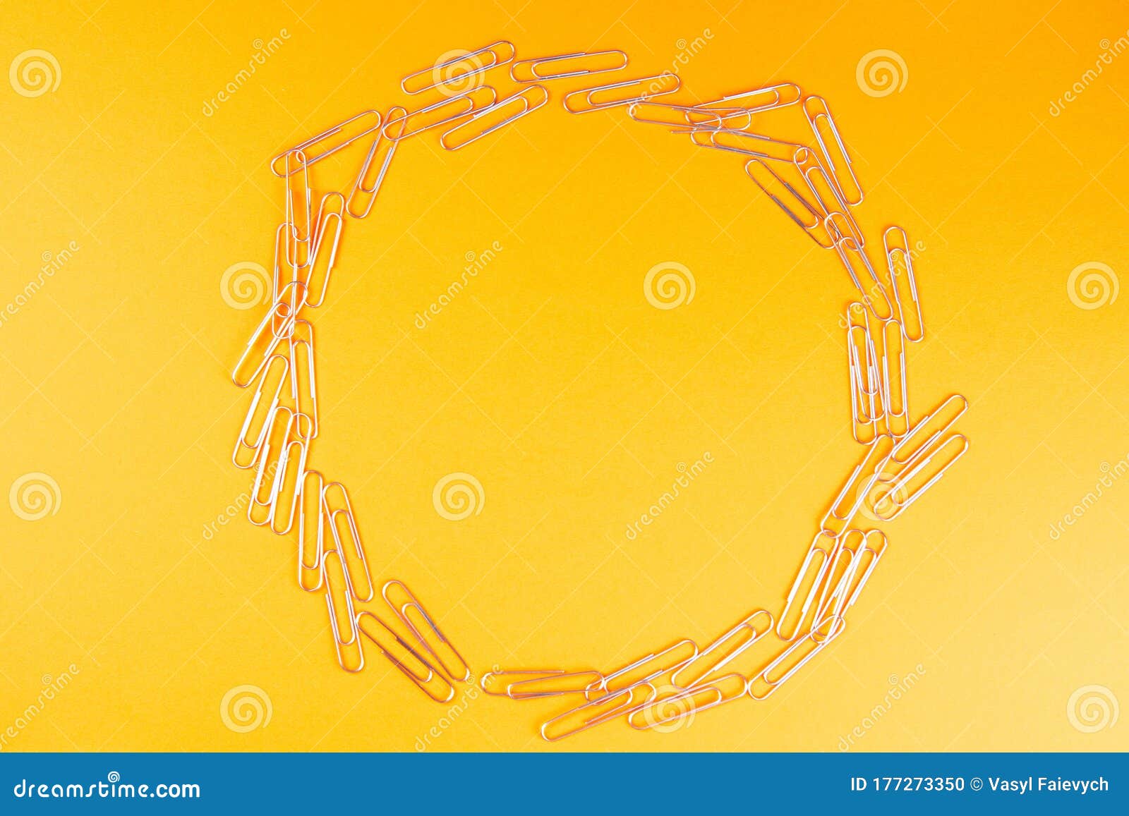 Pile of Colored Paper Clips Arranged in a Circle on an Orange Surface ...