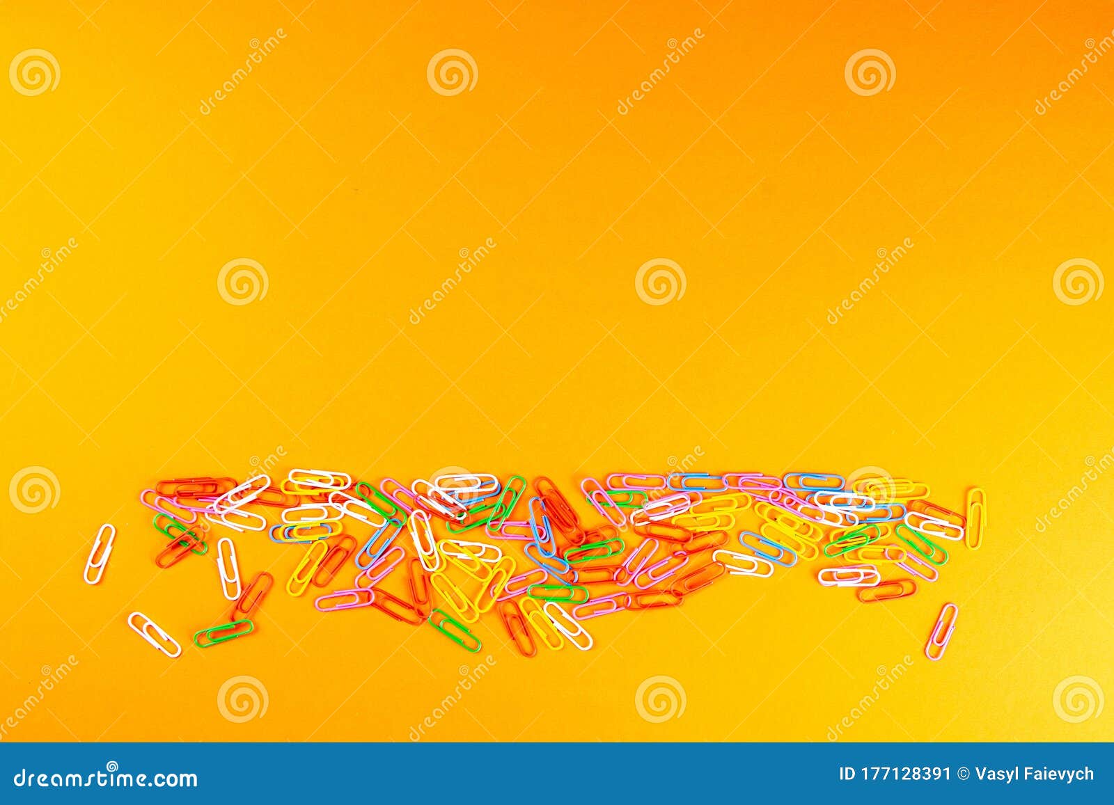 A Pile of Colored Paper Clips Scattered on a Orange Surface Stock Image ...