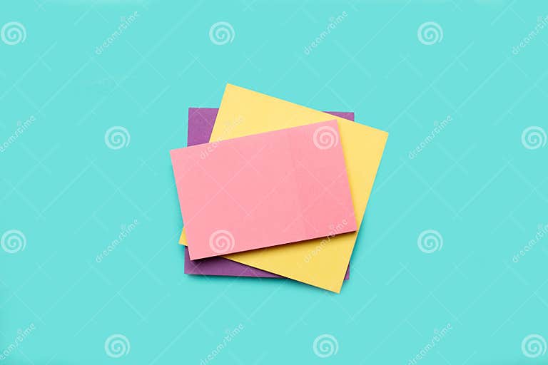A Pile of Colored Paper Notes on a Light Blue Background Stock Image ...