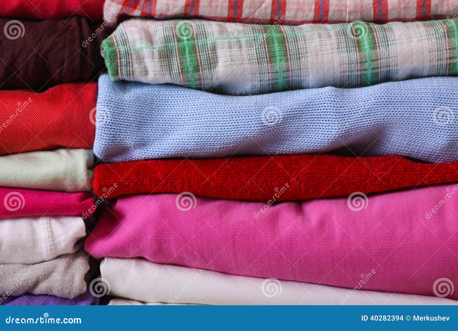 Pile of colorful clothes stock photo. Image of fabric - 40282394