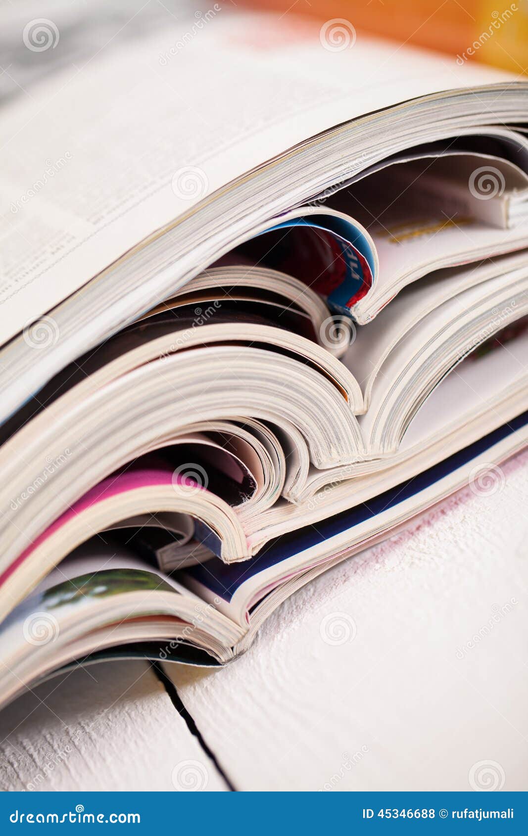 Pile of Colorful Magazines on a Table Stock Photo - Image of closeup ...