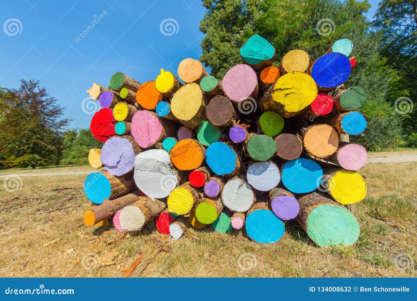 Pile of Colorful Painted Tree Trunks Outside Stock Photo - Image of ...